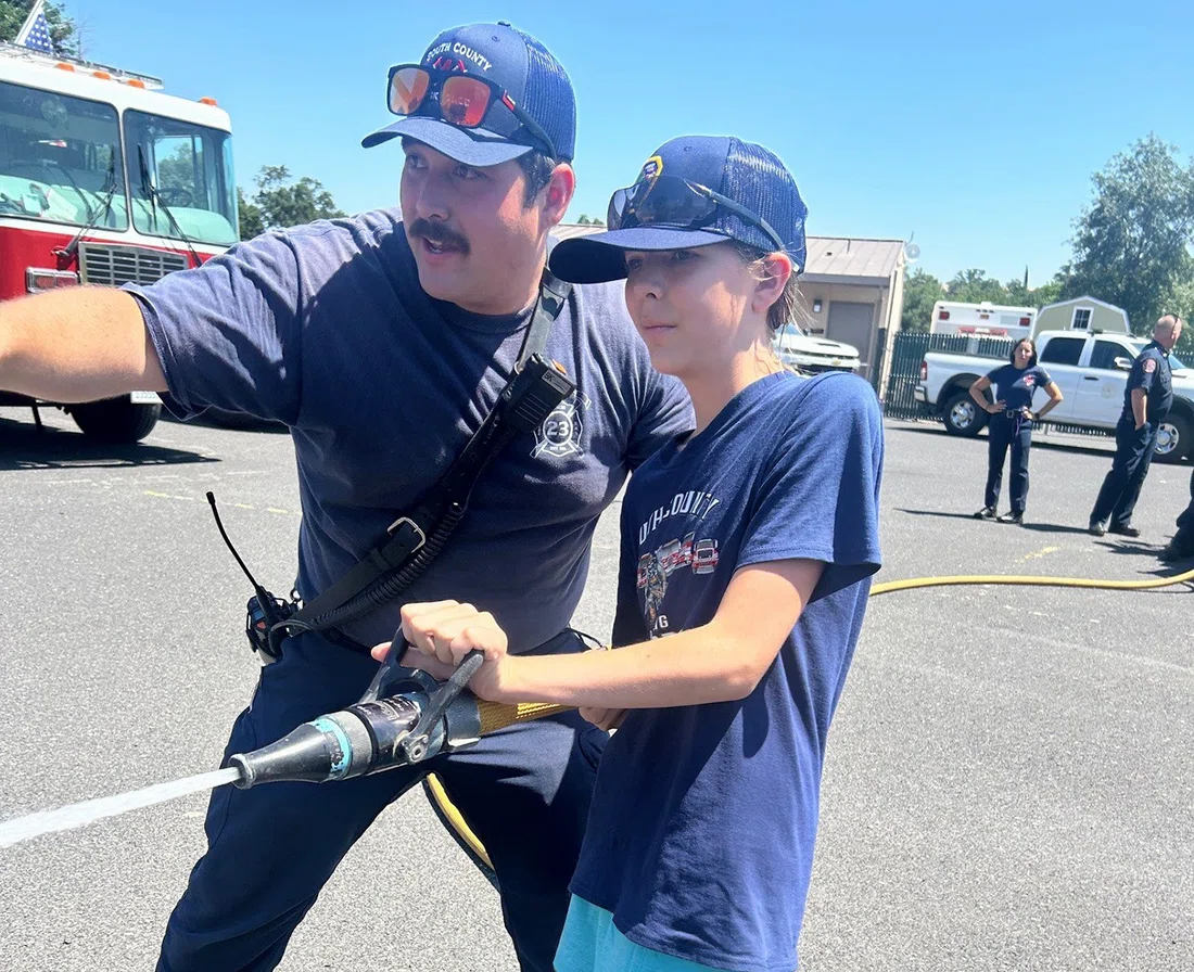 Students learn about firefighting at summer camp